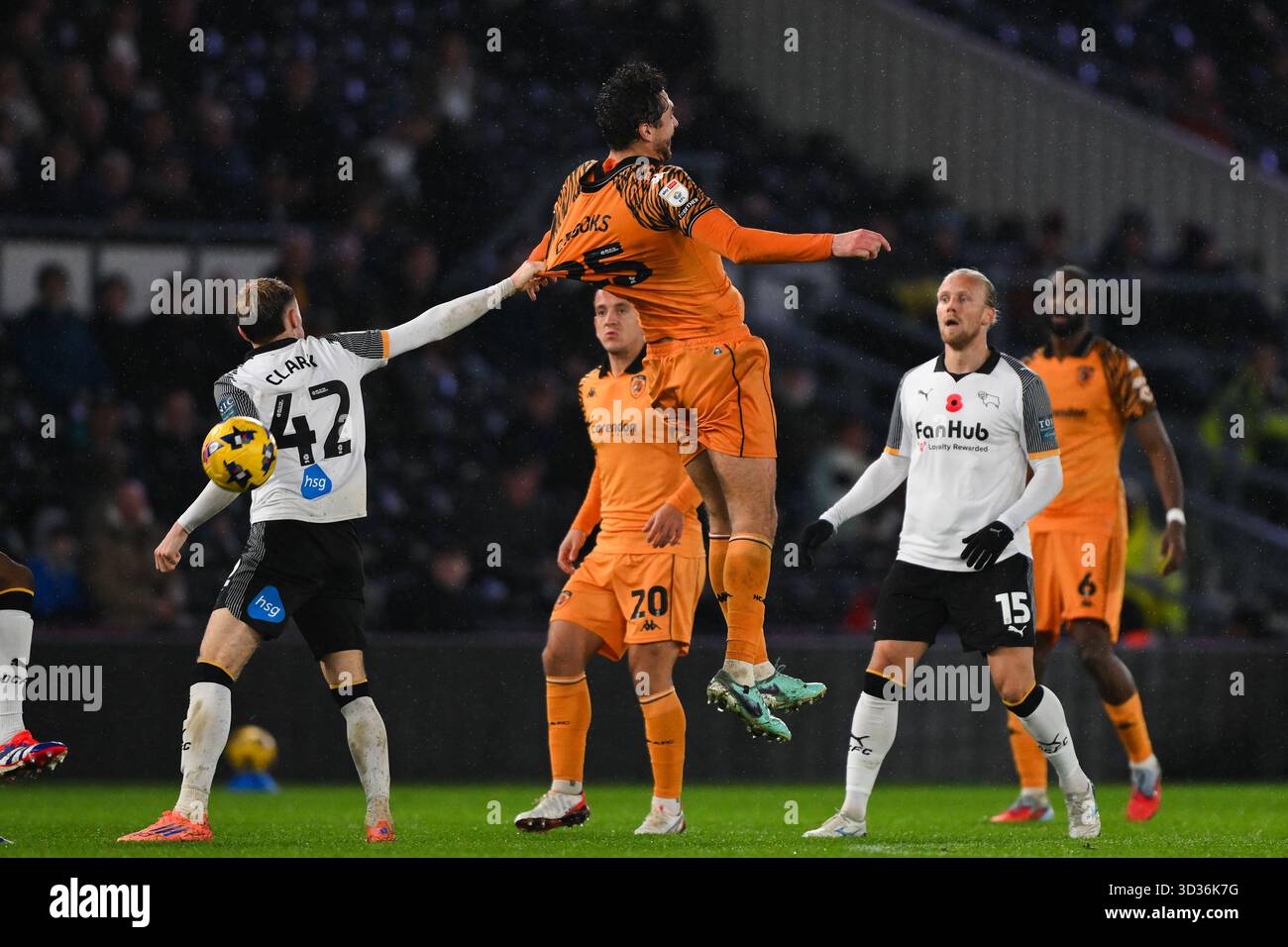 Bobby Clark of Derby County pulls the shirt of Matt Crooks of Hull City ...