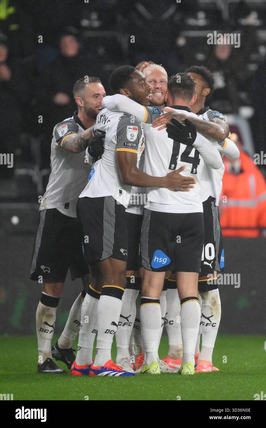 Derby County's Lars-Jorgen Salvesen (centre) celebrates scoring his ...
