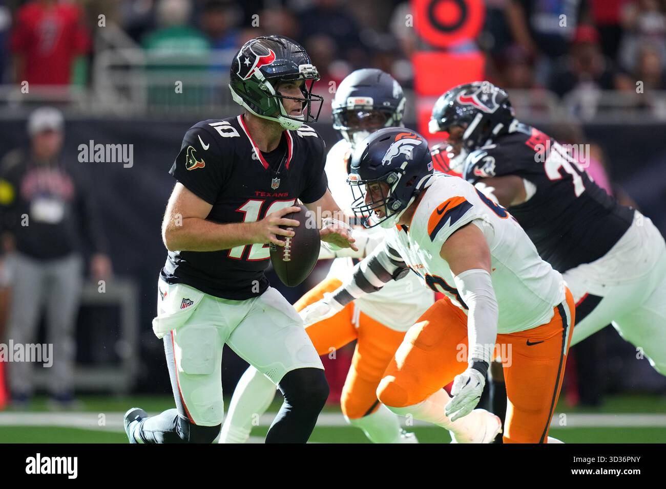 Houston Texans quarterback Davis Mills (10) is sacked by Denver Broncos ...
