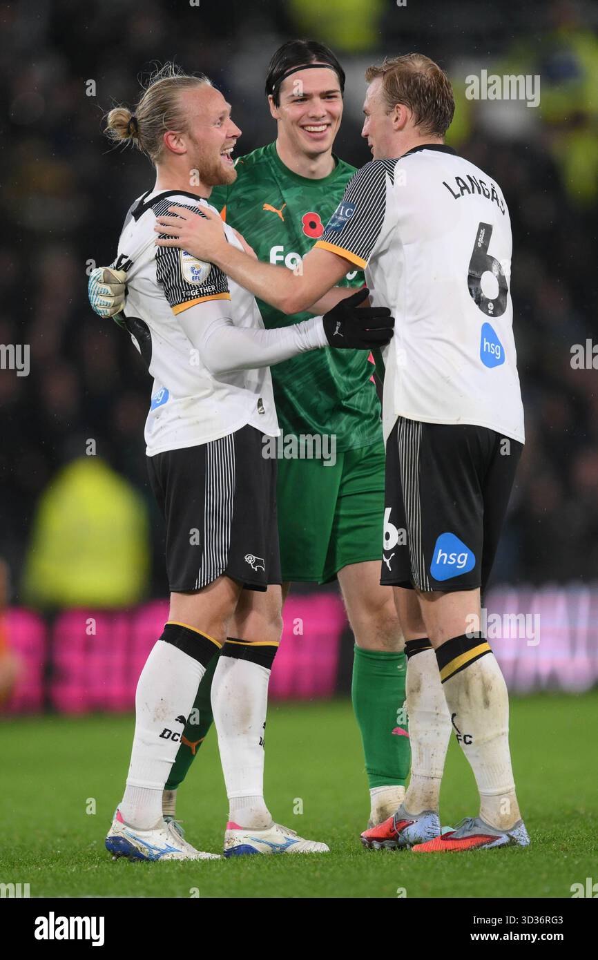 Derby County's Lars-Jorgen Salvesen (left) celebrates scoring his sides ...