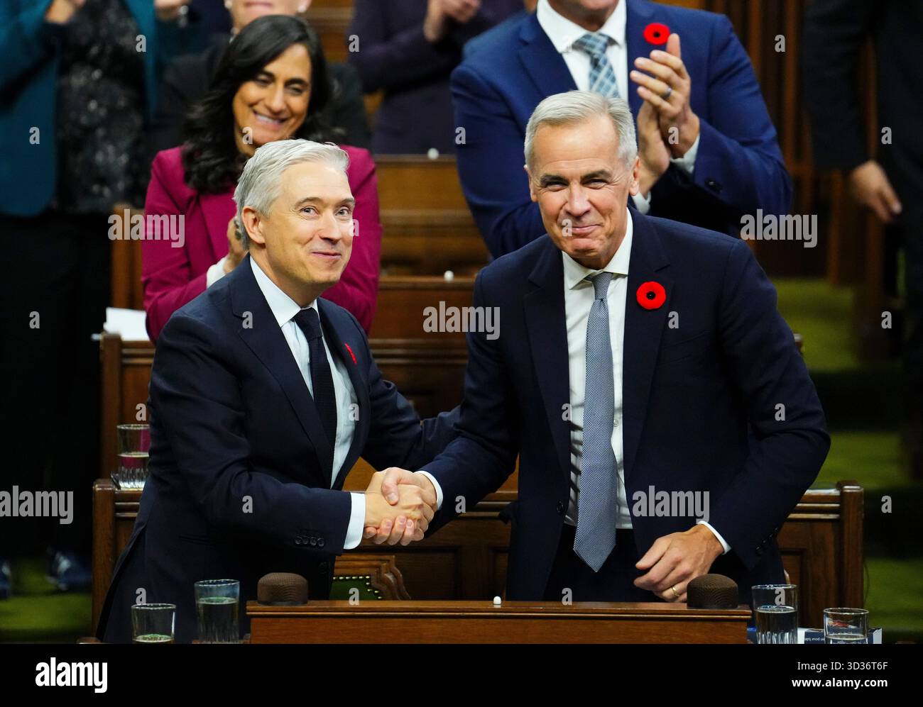 Finance Minister Francois-Philippe Champagne shakes hands with Canada's ...