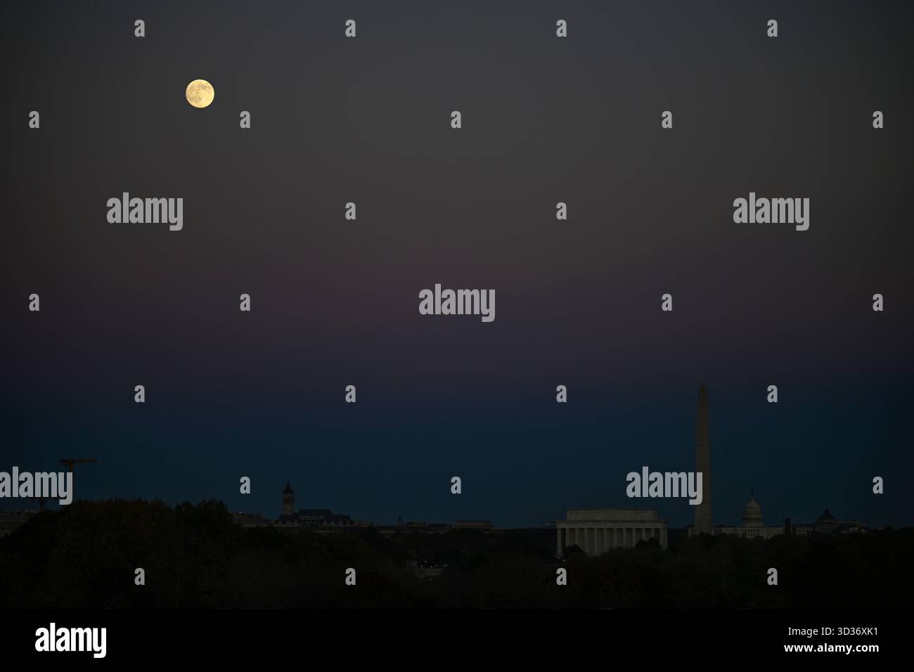 A super moon rises over Washington, Tuesday, Nov. 4, 2025. (AP Photo ...
