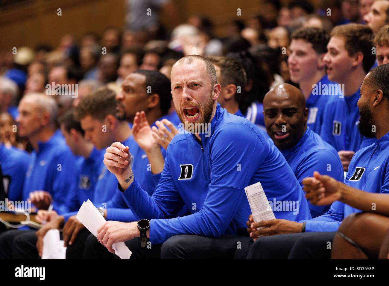 Duke assistant coach Evan Bradds shouts towards the court during an ...