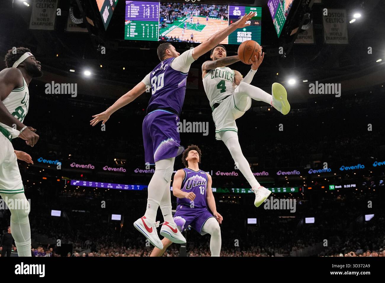 Boston Celtics guard Anfernee Simons (4) drives the basket during an ...