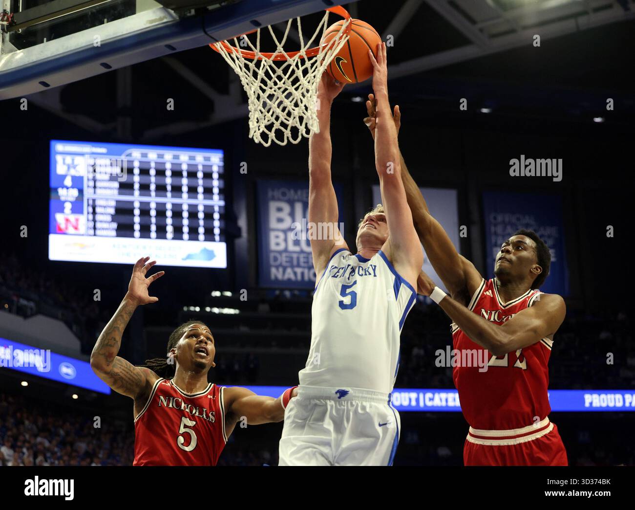 Kentucky's Collin Chandler (5) shoots between Nicholls' Jalik Dunkley ...