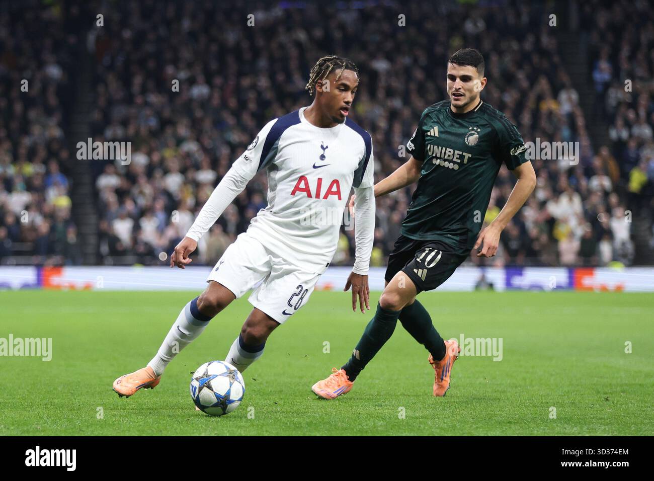 Wilson Odobert of Tottenham Hotspur receives pressure from Mohamed ...