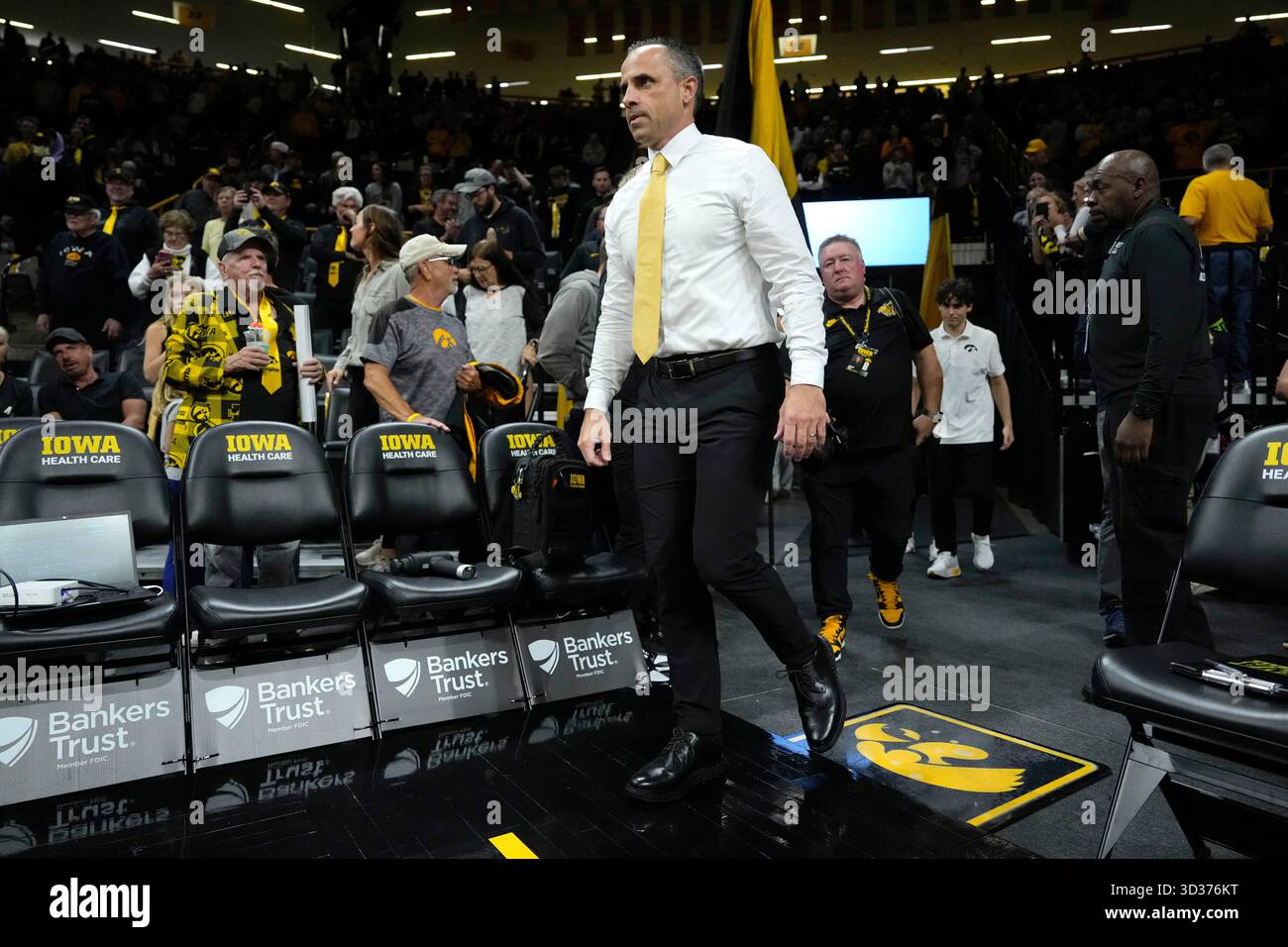 New Iowa head coach Ben McCollum walks onto the court before an NCAA ...
