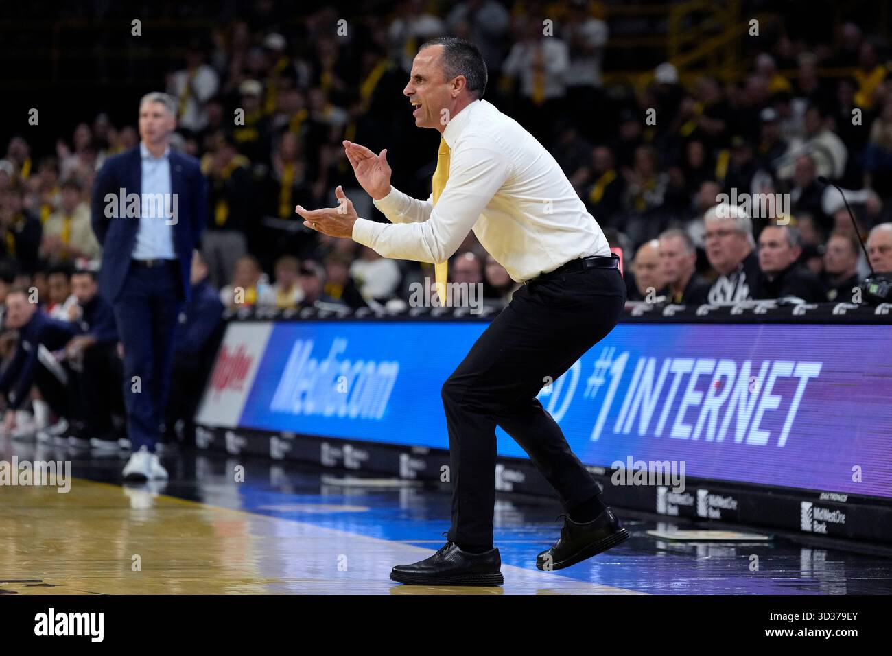 Iowa head coach Ben McCollum reacts during the first half of an NCAA ...