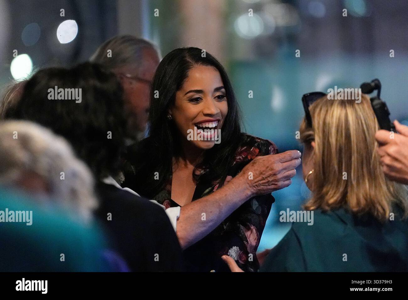 Democratic 18th Congressional District candidate Amanda Edwards, center ...