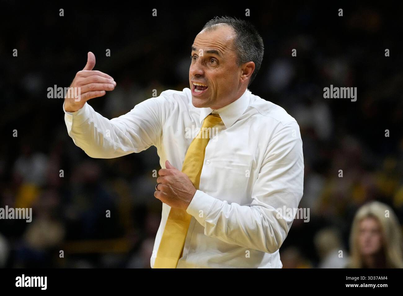 Iowa head coach Ben McCollum directs his team during the first half of ...