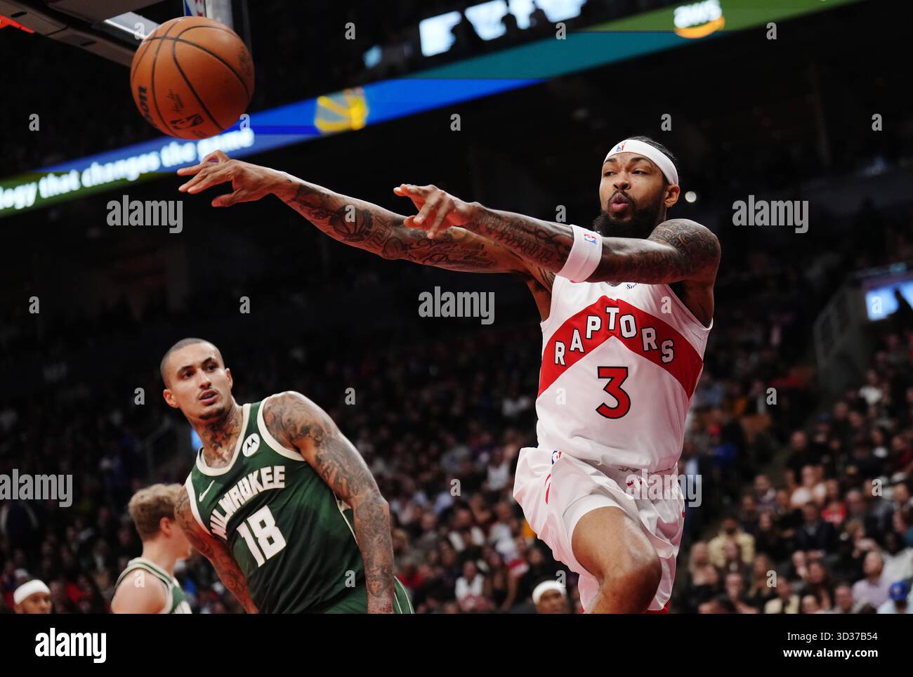 Toronto Raptors' Brandon Ingram (3) passes as Milwaukee Bucks' Kyle ...