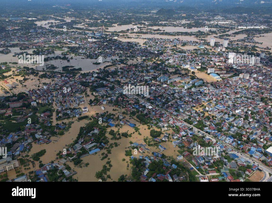 FILE- This aerial image shows flooding in the aftermath of typhoon ...