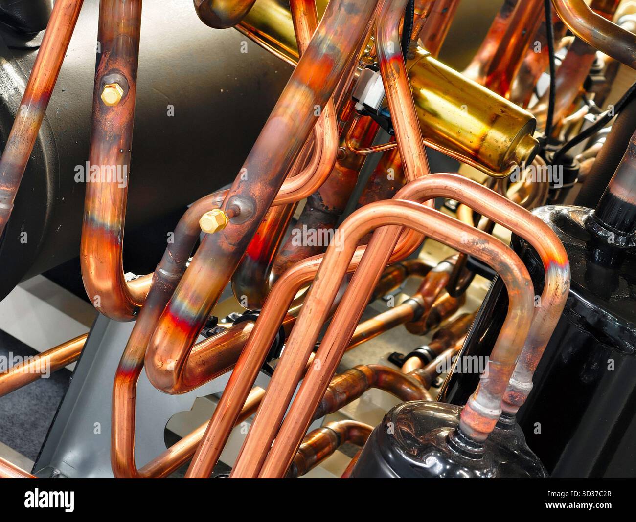 Copper pipes link factory refrigeration systems, highlighting their ...