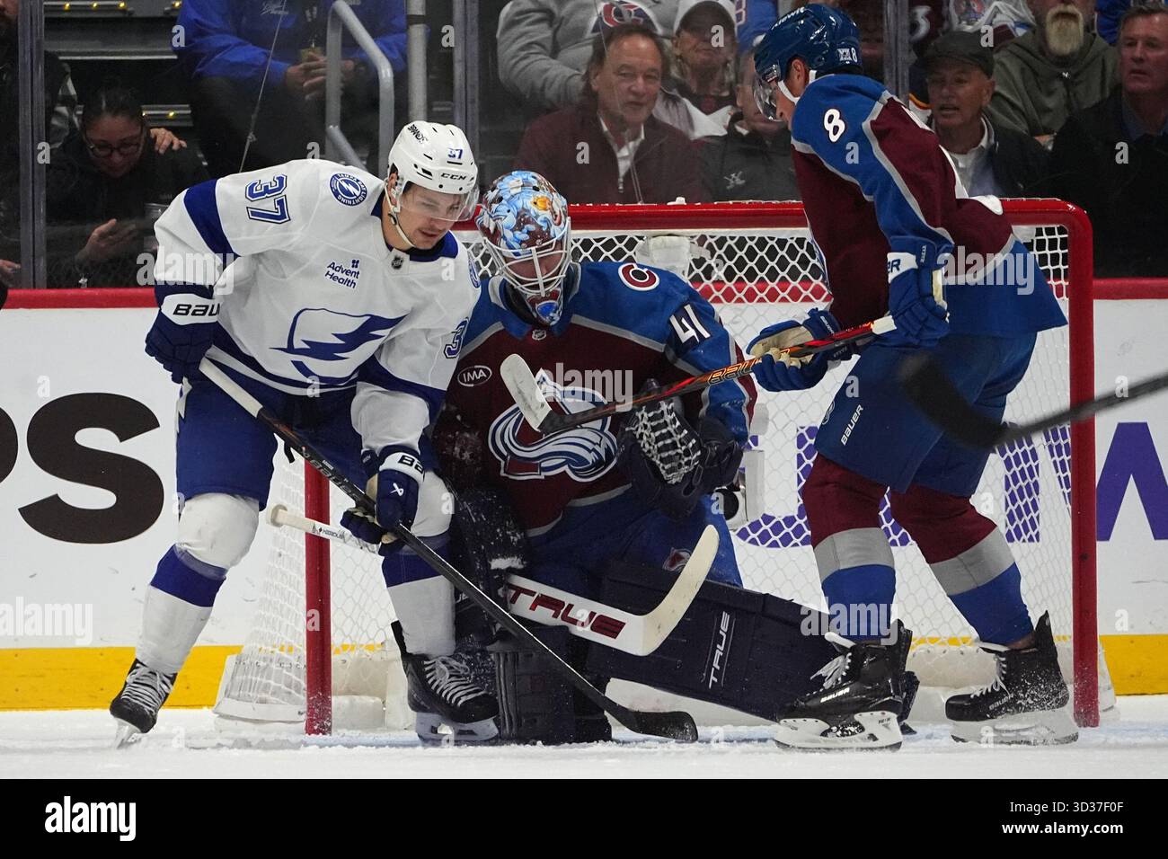 Tampa Bay Lightning center Yanni Gourde, left, looks on as Colorado ...