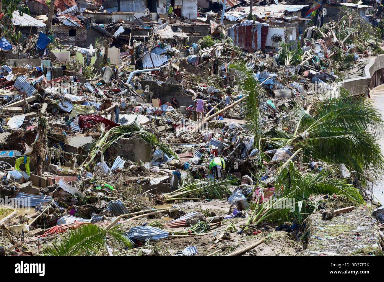 Residents return to what remains of their homes after Typhoon Kalmaegi ...