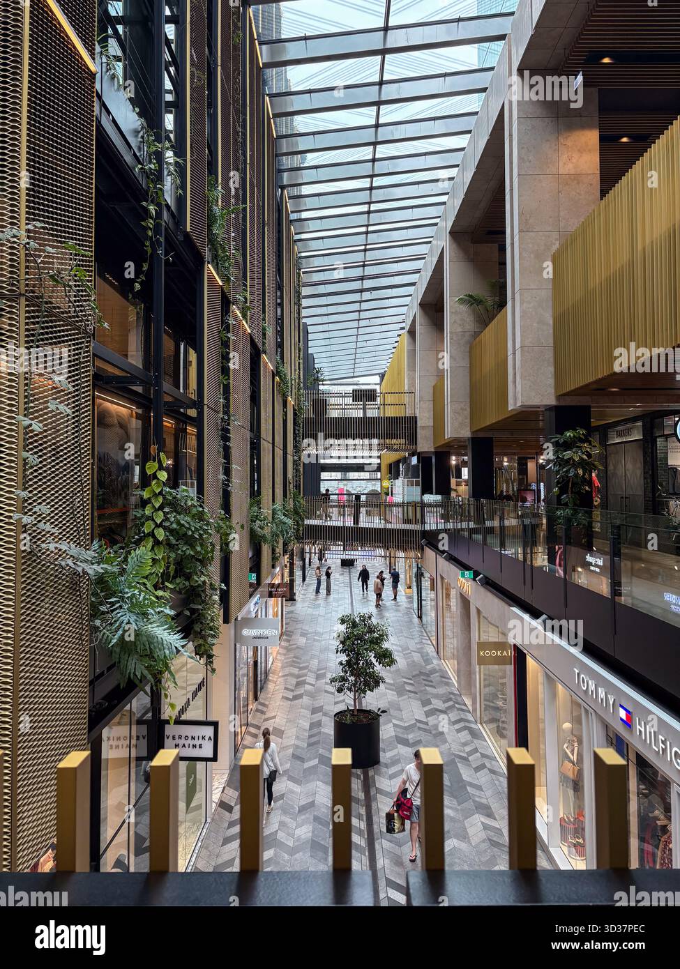Commercial Bay. Modern interior of a multi-level shopping mall with a ...