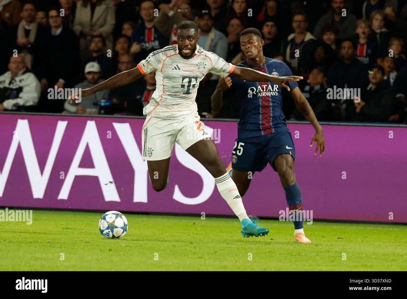 PSG’s Dayot Upamecano battles Bayern Munich’s Nuno Mendes during the ...