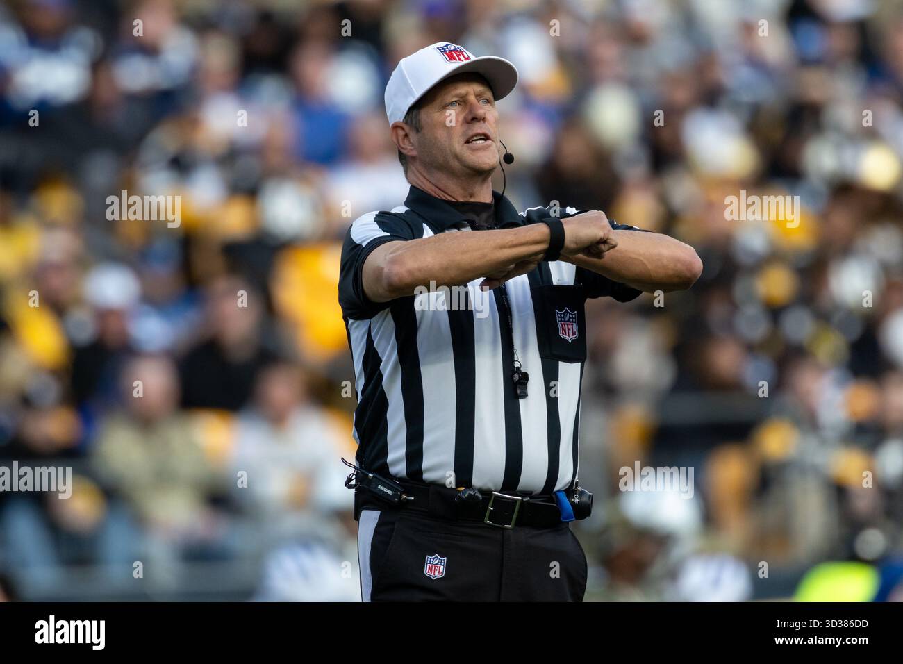Referee Craig Wrolstad (4) signals during an NFL football game, Sunday ...