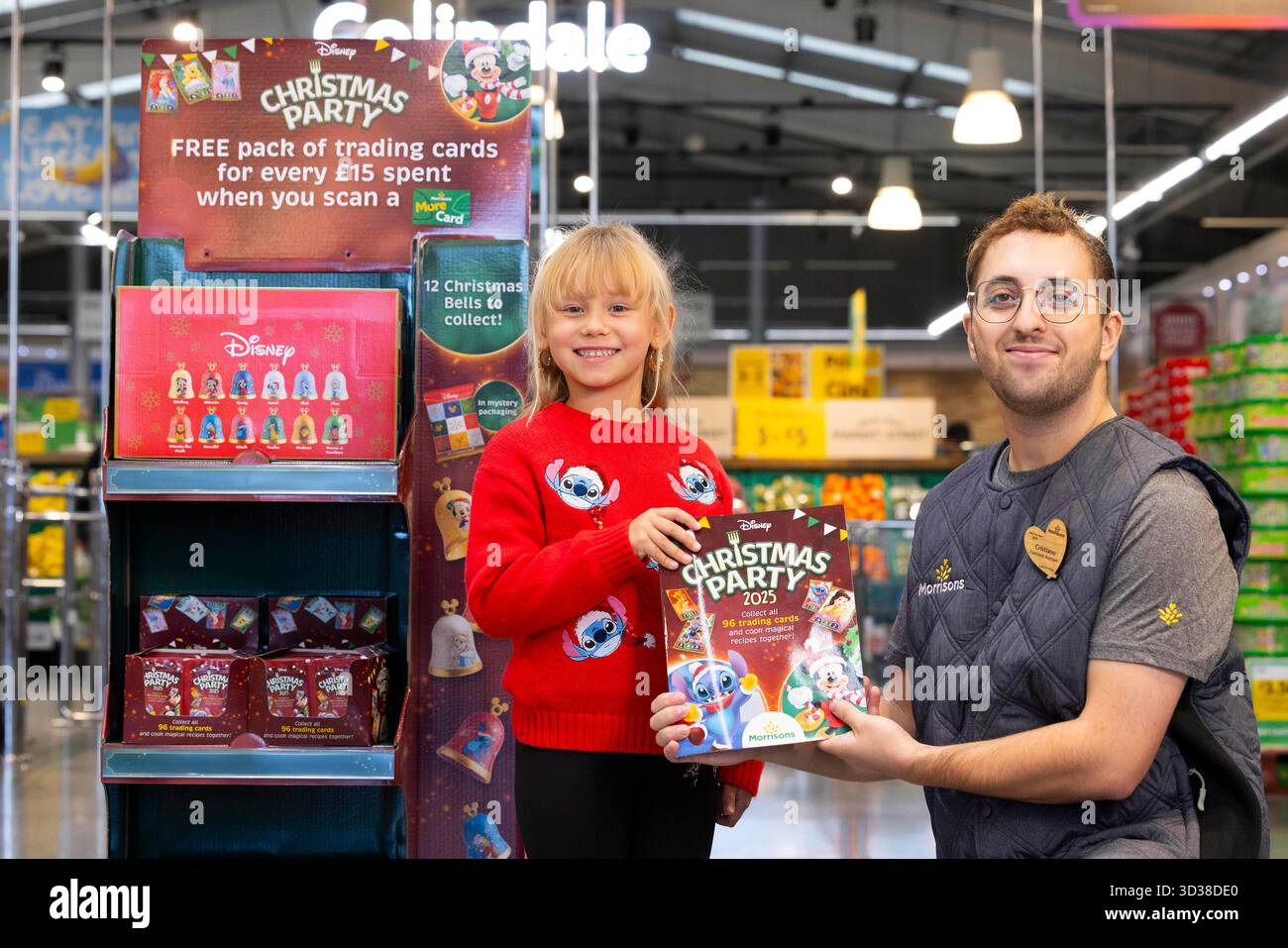 EDITORIAL USE ONLY Darcey, aged seven, with Customer Assistant ...