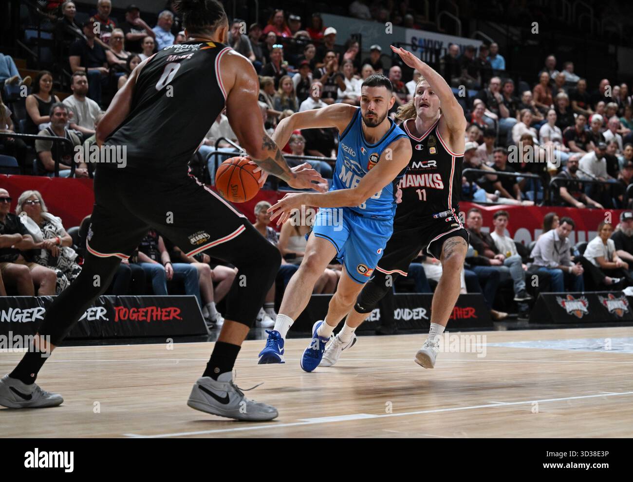 Chris Goulding of United and Daniel Grida of the Hawks during the NBL ...