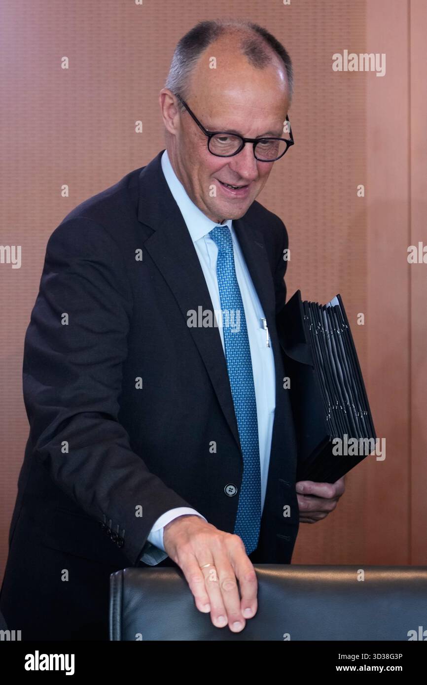 German Chancellor Friedrich Merz arrives for the cabinet meeting at the ...