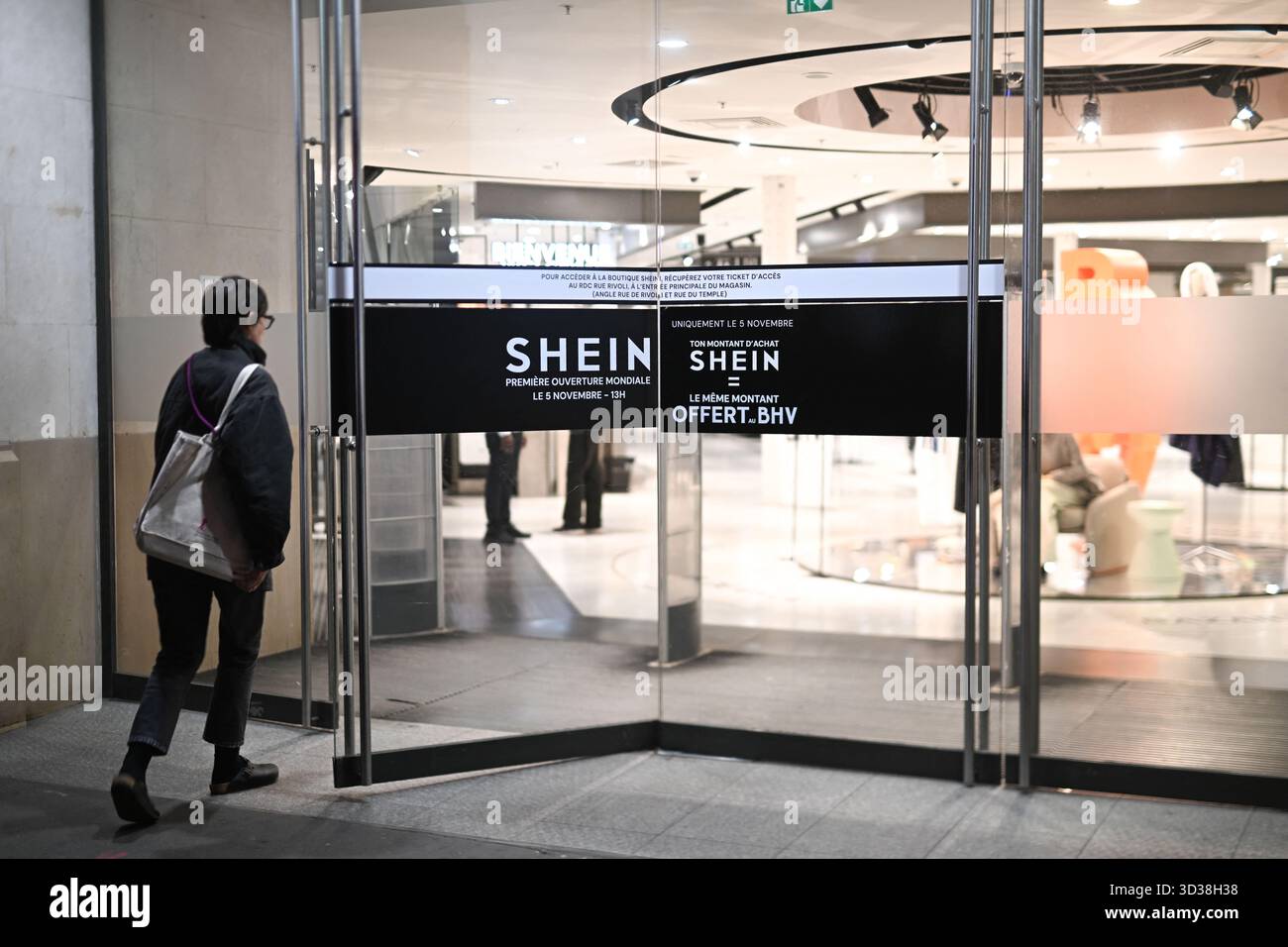 Shein brand banners are displayed on the front of the BHV store, in ...