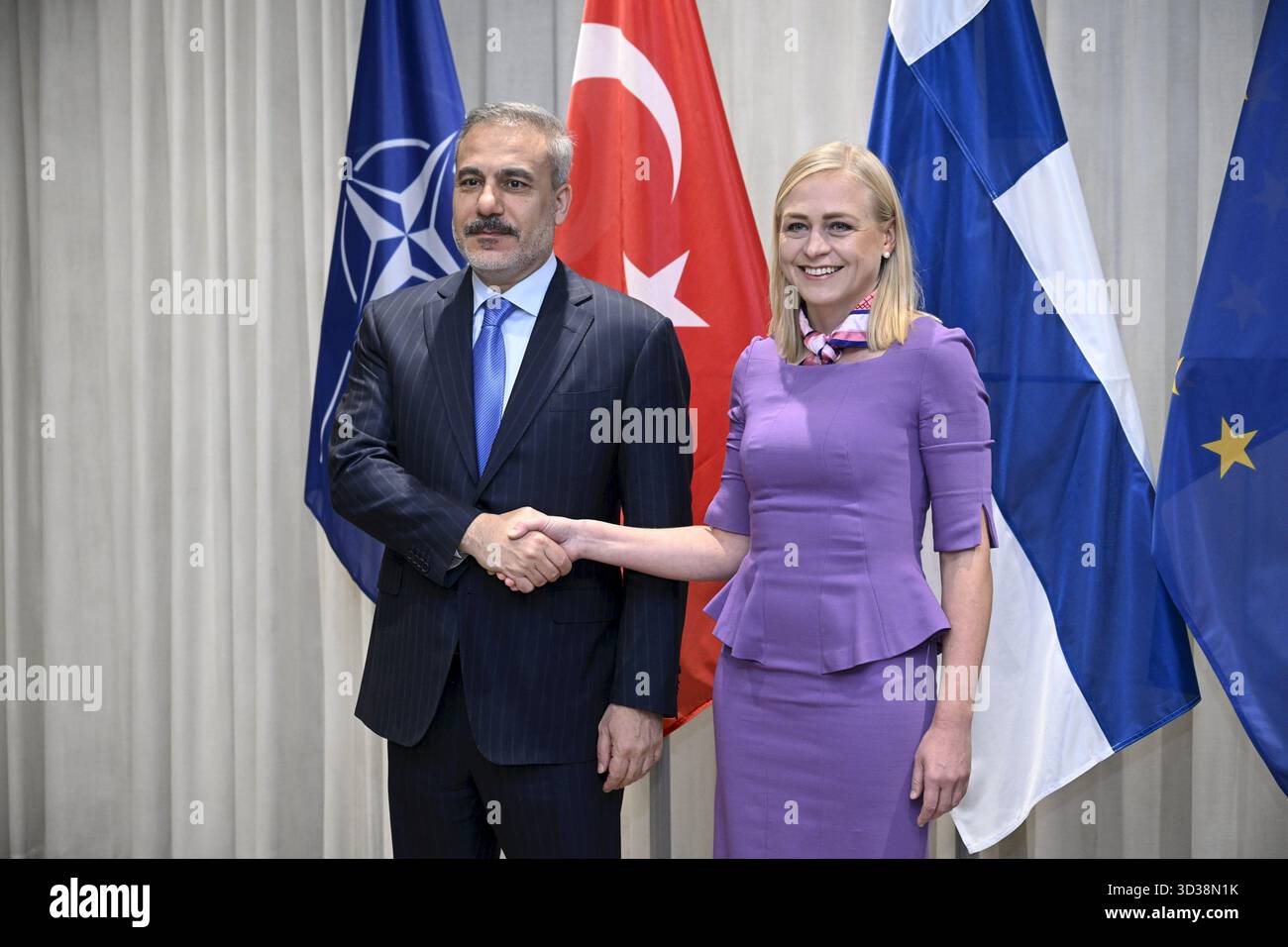 Finnish Foreign Minister Elina Valtonen, right, welcomes Turkish ...