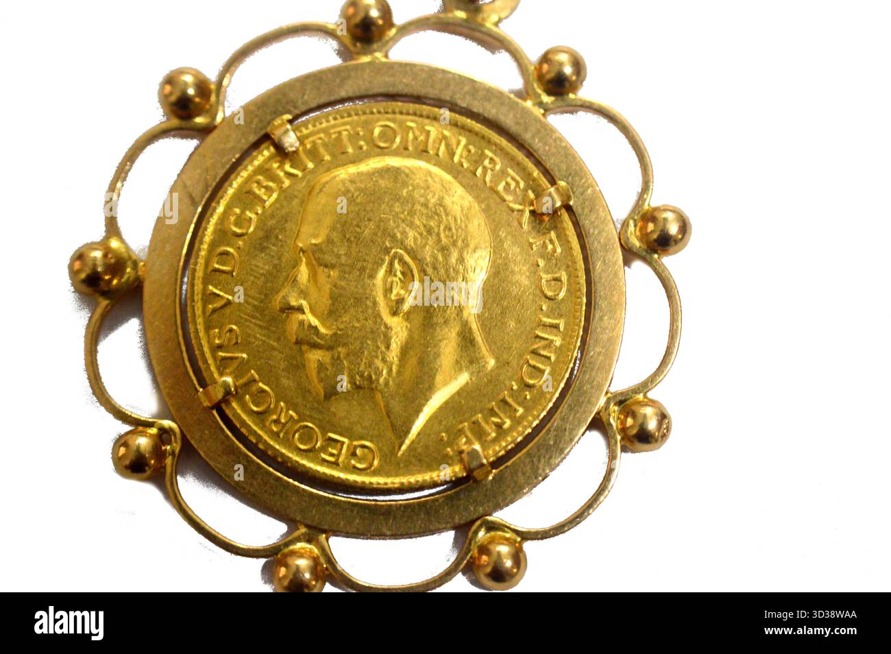 The obverse side of King George V gold sovereign coin, features a left ...