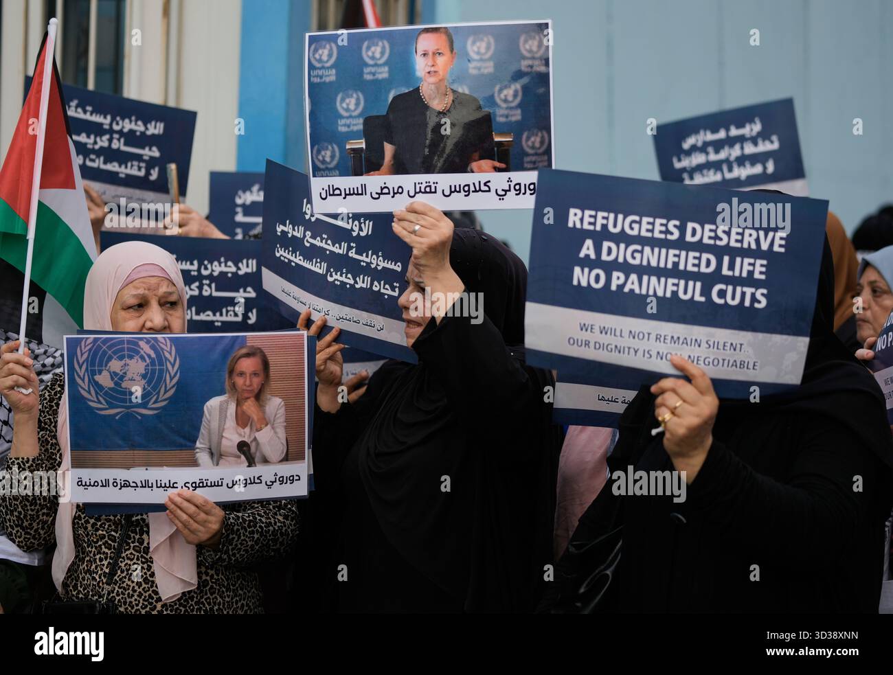 Palestinians in Lebanon chant slogans during a protest against ...