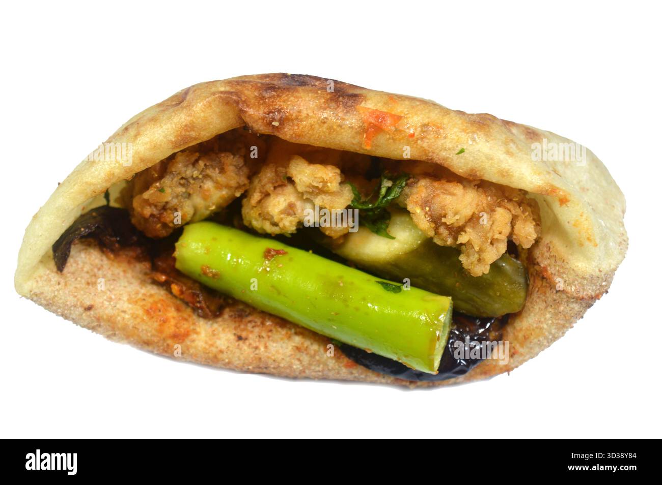 Cow beef brain covered with flour and fried in deep hot oil with green ...