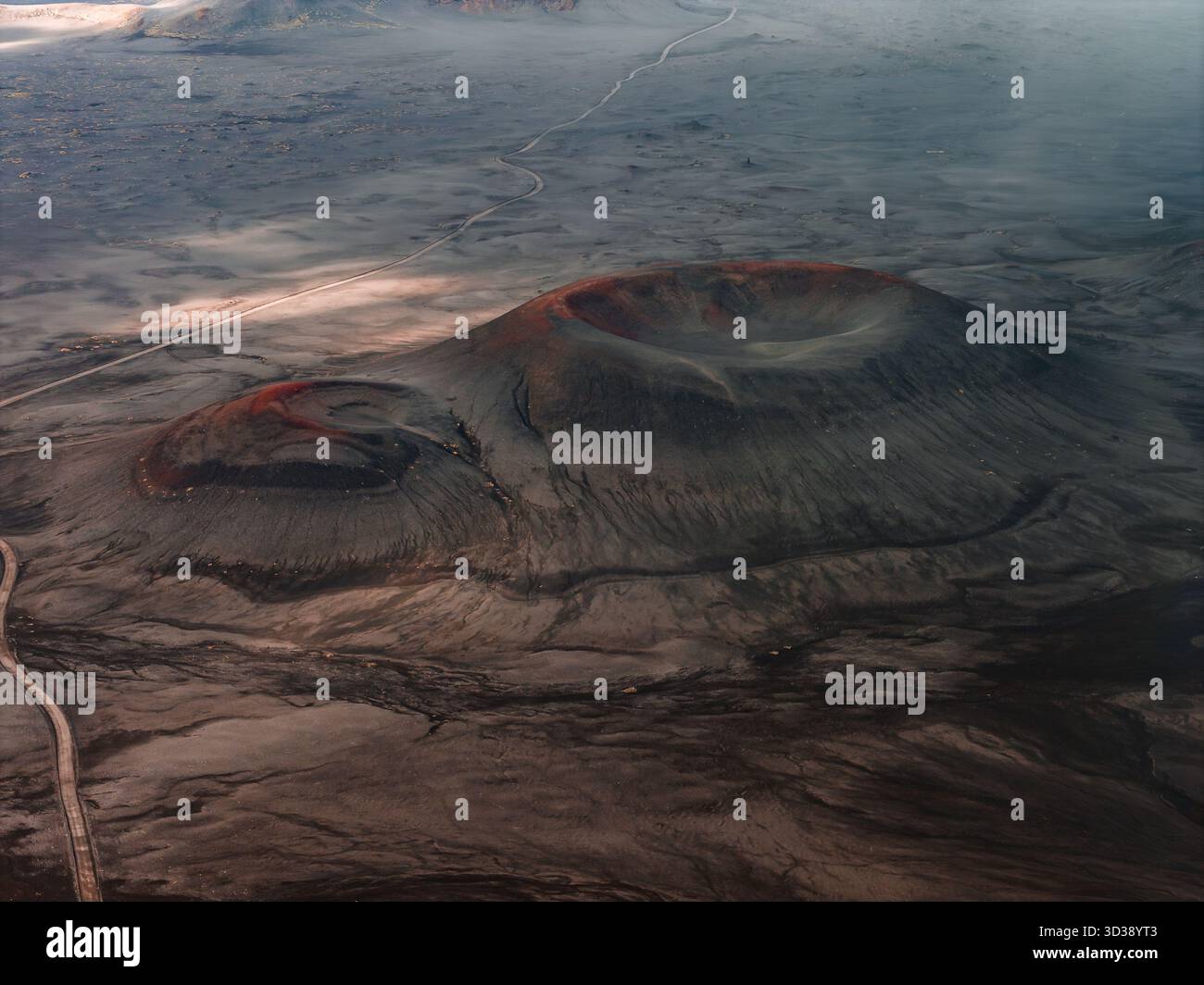 Aerial view of twin ash dusted volcanic craters in Iceland highlands ...