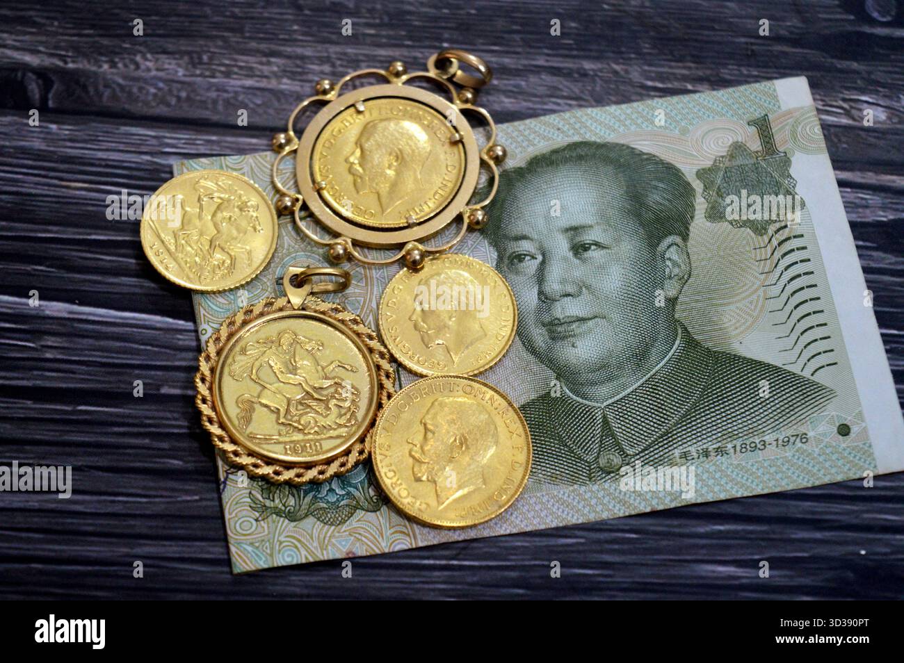 Chinese Yuan CNY money banknote bill and King George V gold sovereign ...