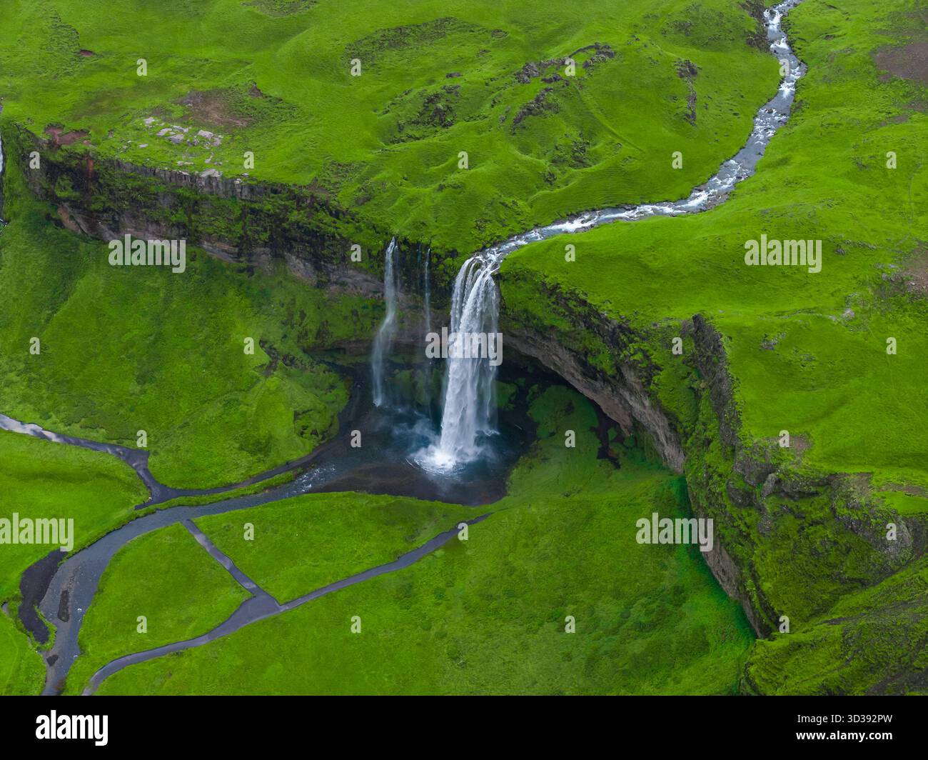 Aerial view of Seljalandsfoss waterfall and basalt cliffs in Iceland ...