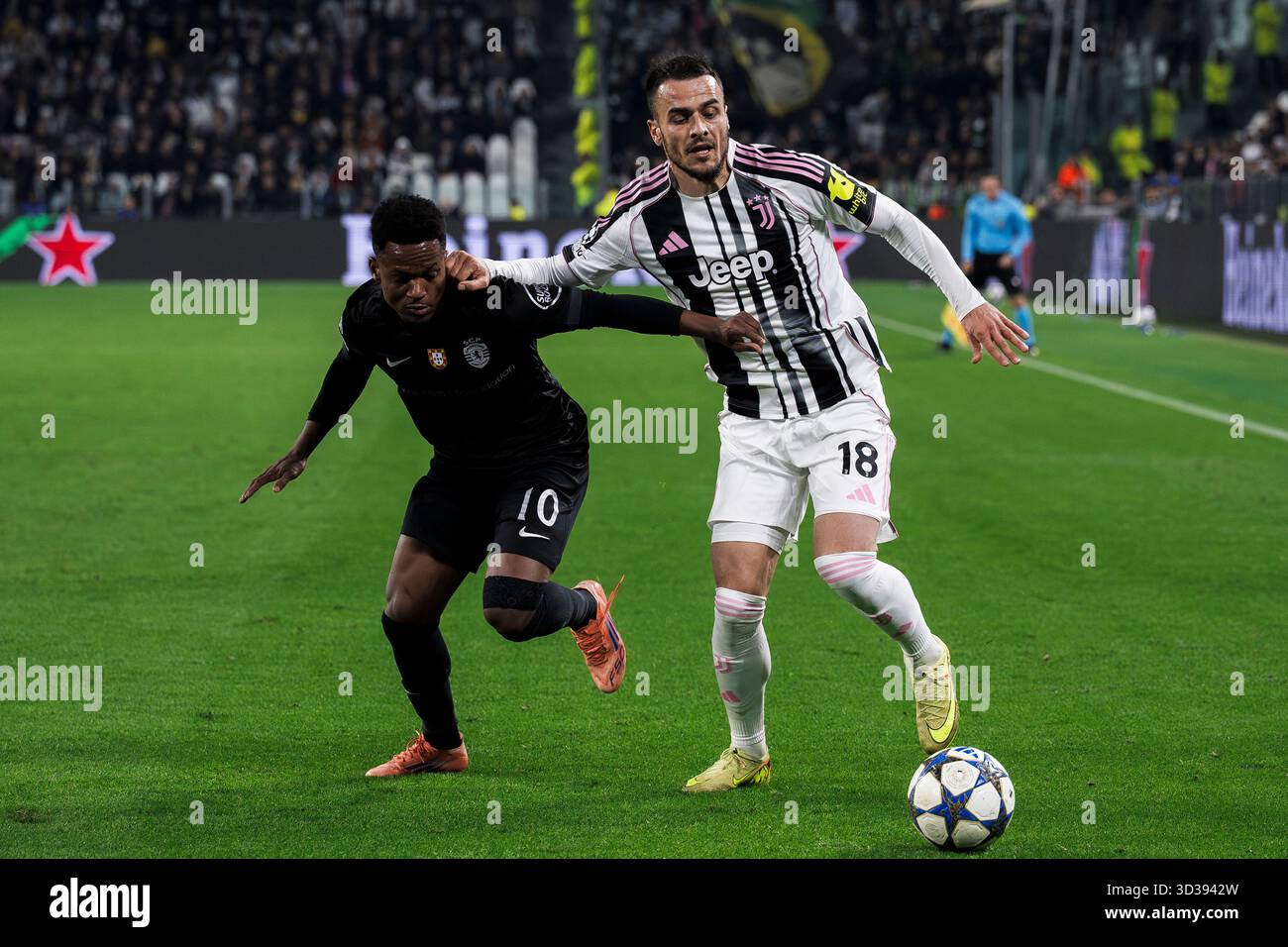 Filip Kostic of Juventus FC competes for the ball with Geny Catamo of ...