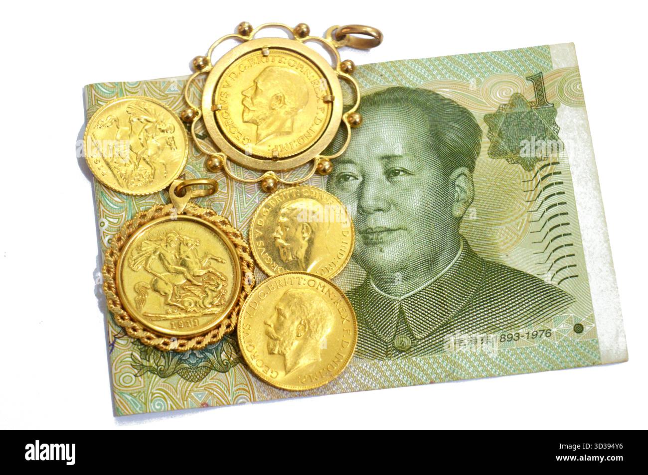 Chinese Yuan CNY money banknote bill and King George V gold sovereign ...