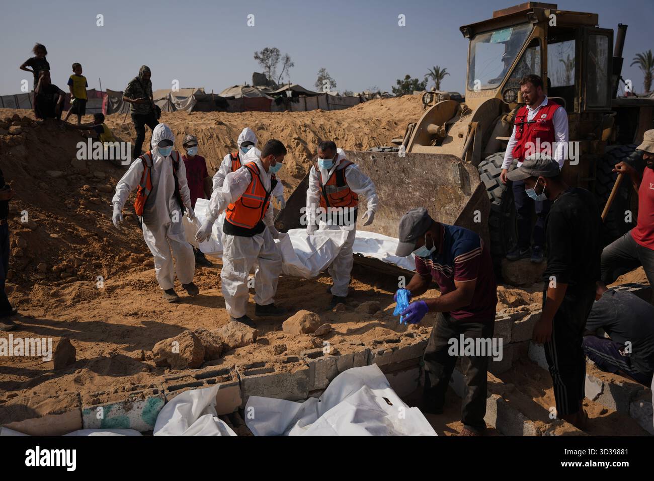 Bodies of unidentified Palestinians returned from Israel as part of the ceasefire deal are ...