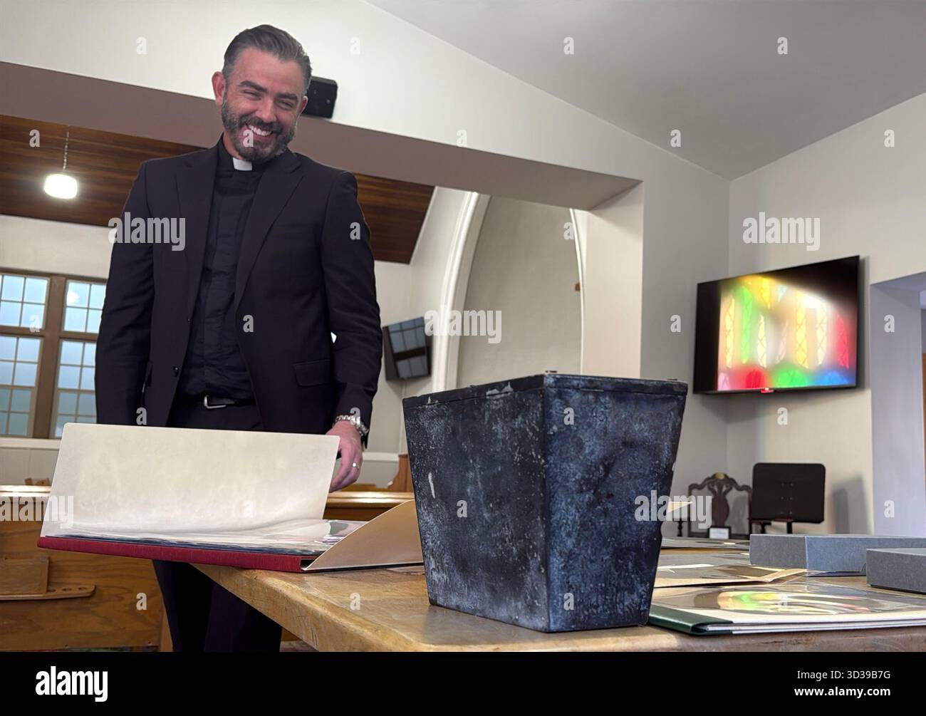 Rev. Andrew Fleishman looks at a century-old time capsule at the ...