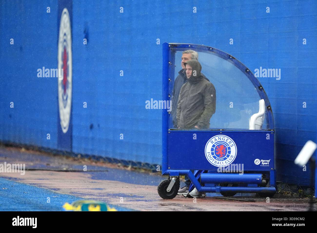 Rangers chairman Andrew Cavenagh (left) watches on during a training ...