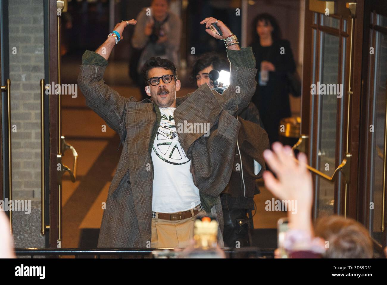Streamer and political commentator Hasan Piker cheers as he exits ...