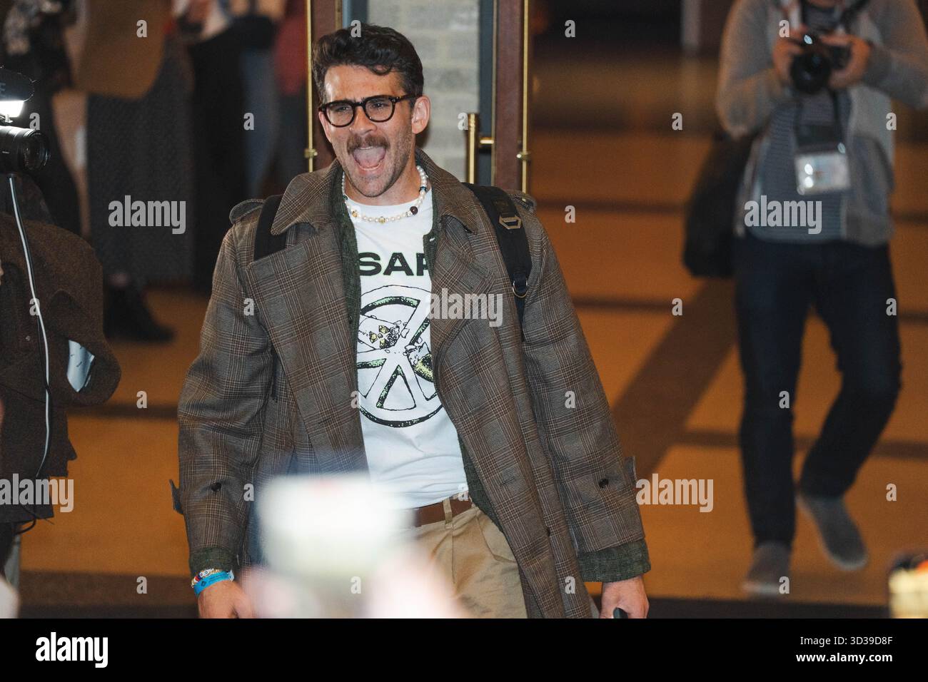 Streamer and political commentator Hasan Piker cheers as he exits ...