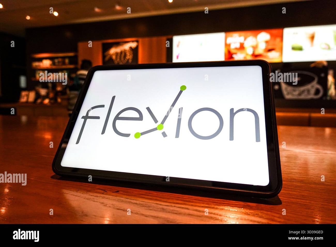 In this photo illustration, the Flexion logo is displayed on the screen ...