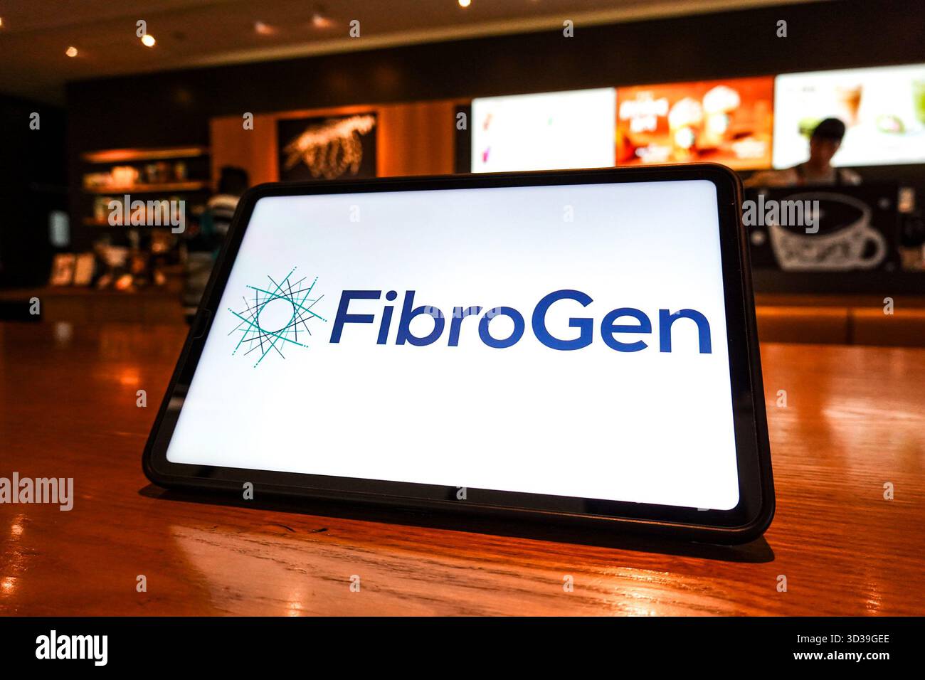 In this photo illustration, the FibroGen logo is displayed on the ...