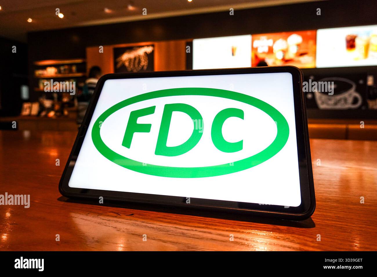 In this photo illustration, the FDC logo is displayed on the screen of ...