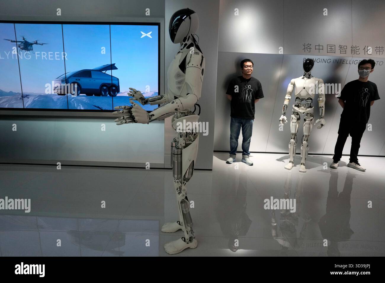 The first generation IRON robot by XPENG guide visitors during the ...