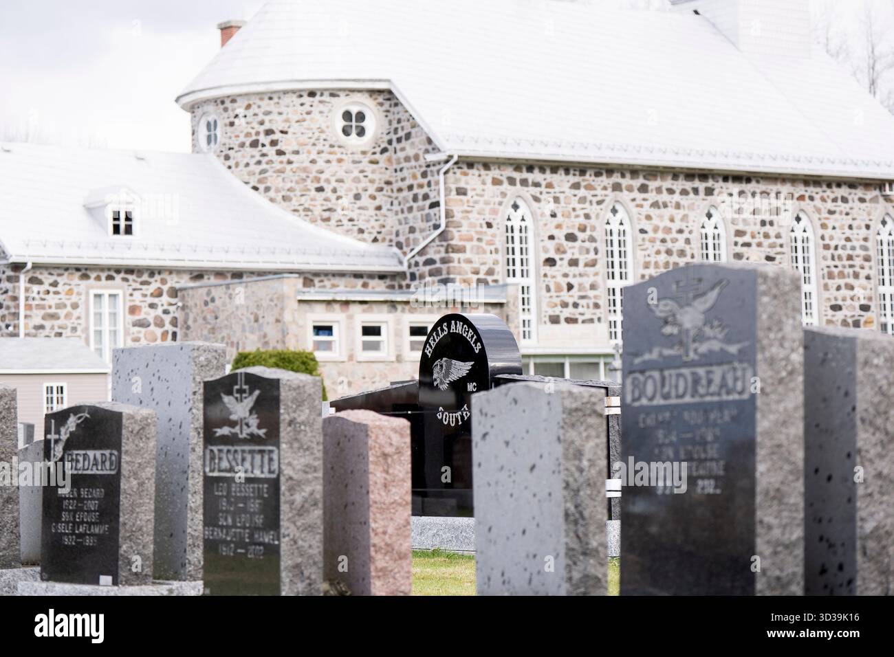 A marble headstone dedicated to the Hells Angels is seen at a cemetery ...