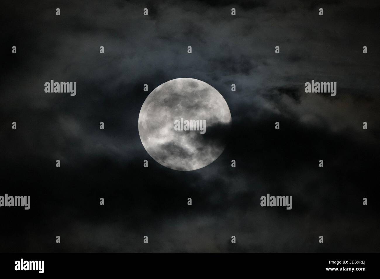 A view of the supermoon seen through clouds from Yangon, Myanmar, Wednesday, Nov. 5, 2025. (AP ...