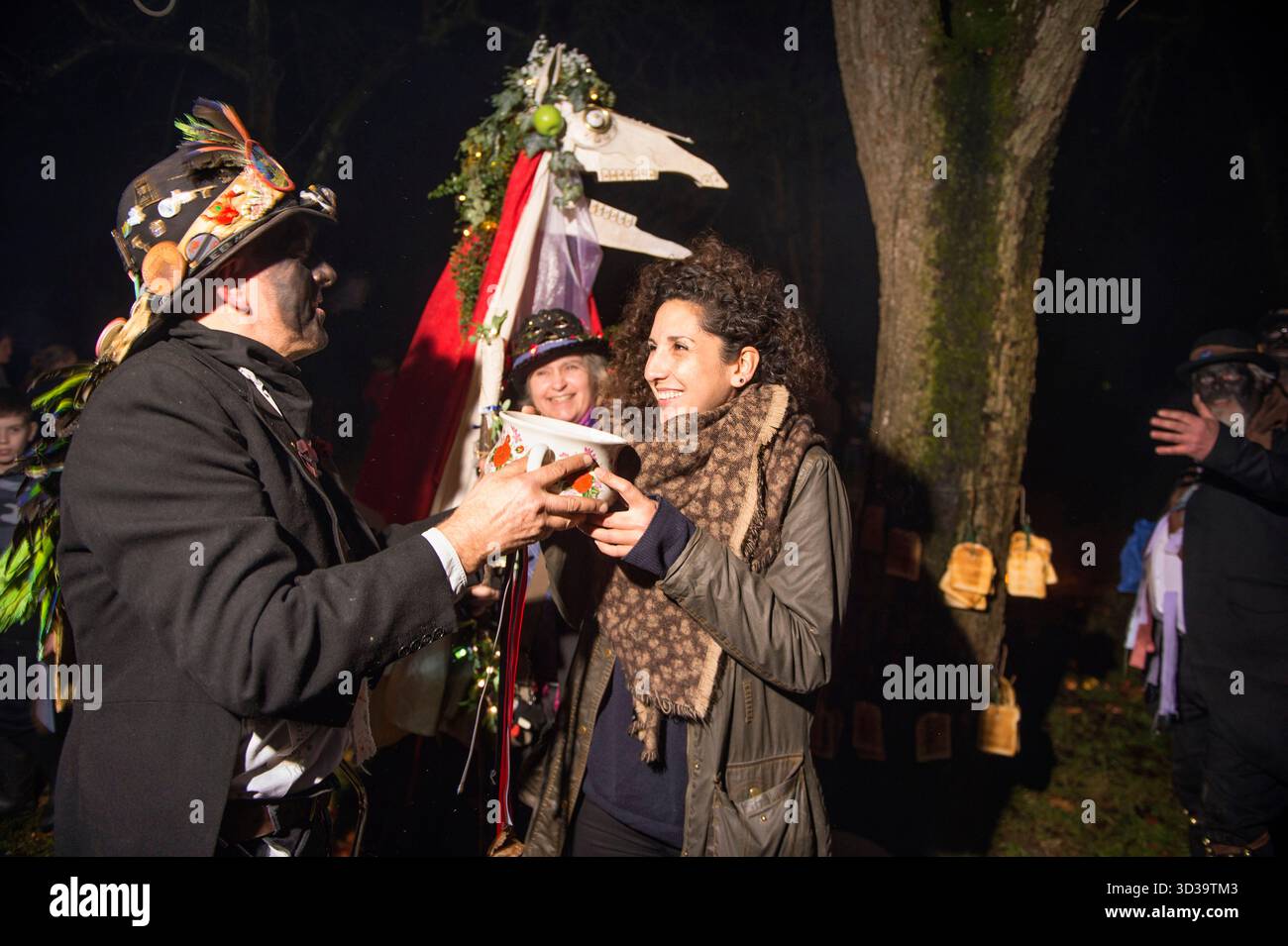 Roger Page of the Silurian Morris Men offers the ceremonial cider bowl ...