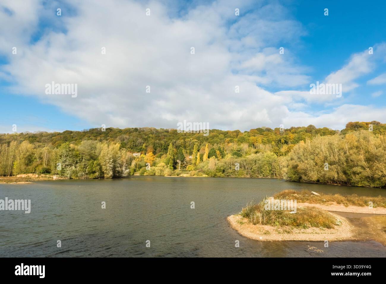 View across Bodenham Lake with Autumn colours showing in the woodland ...