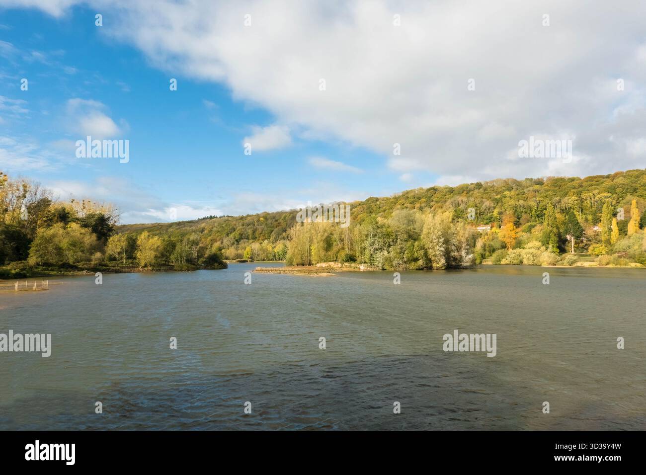 View across Bodenham Lake with Autumn colours showing in the woodland ...
