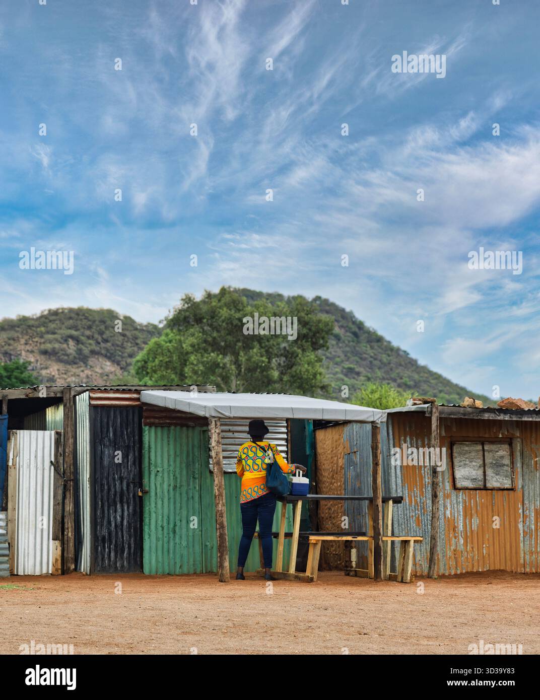 african woman worker going to work in the morning in the shanty town ...